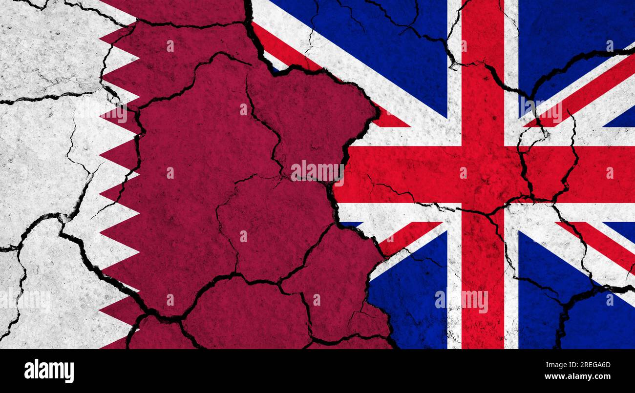 Flags of Qatar and United Kingdom on cracked surface - politics ...