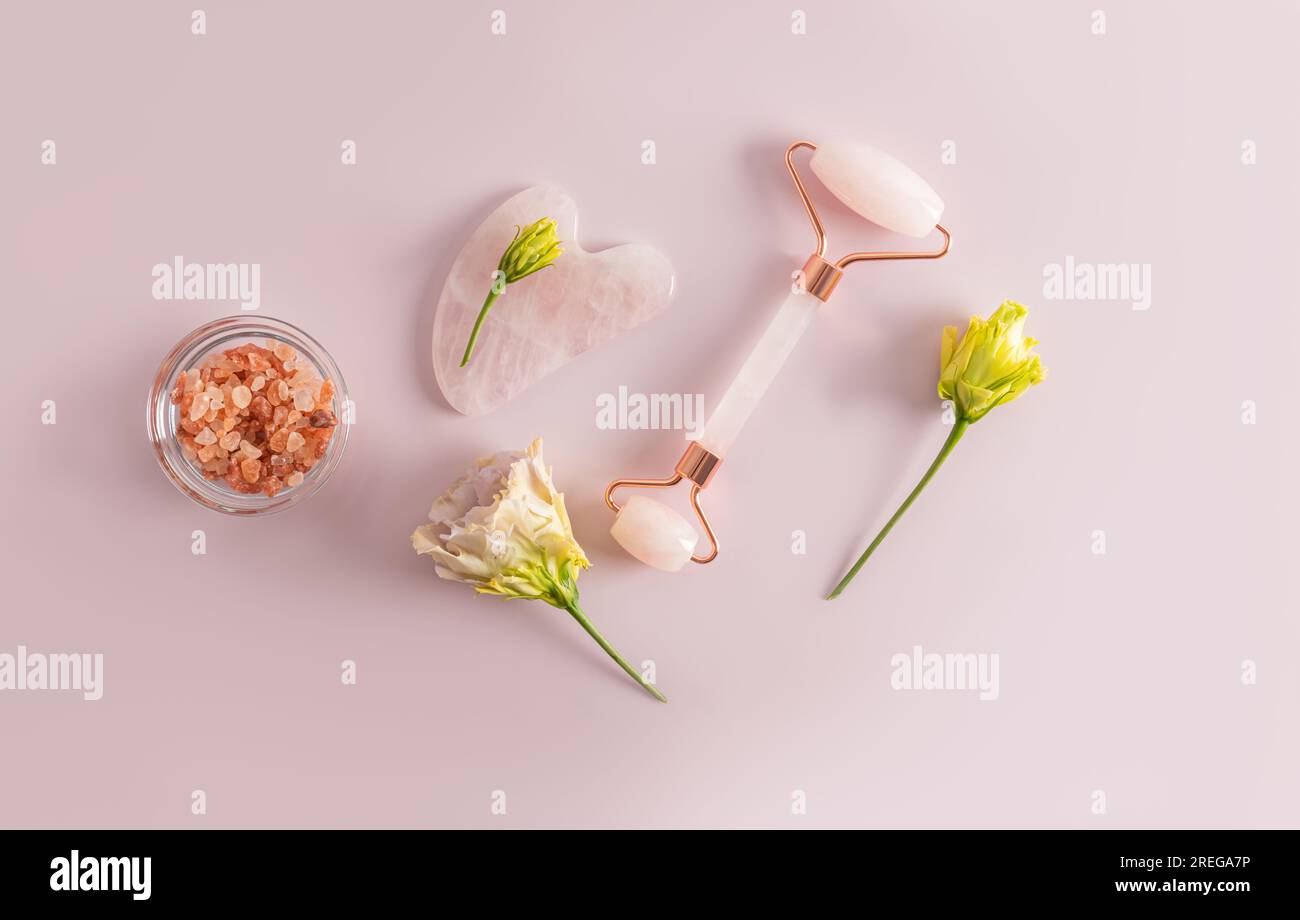 Top view of the items for massage of the face and, neck. rose quartz ...