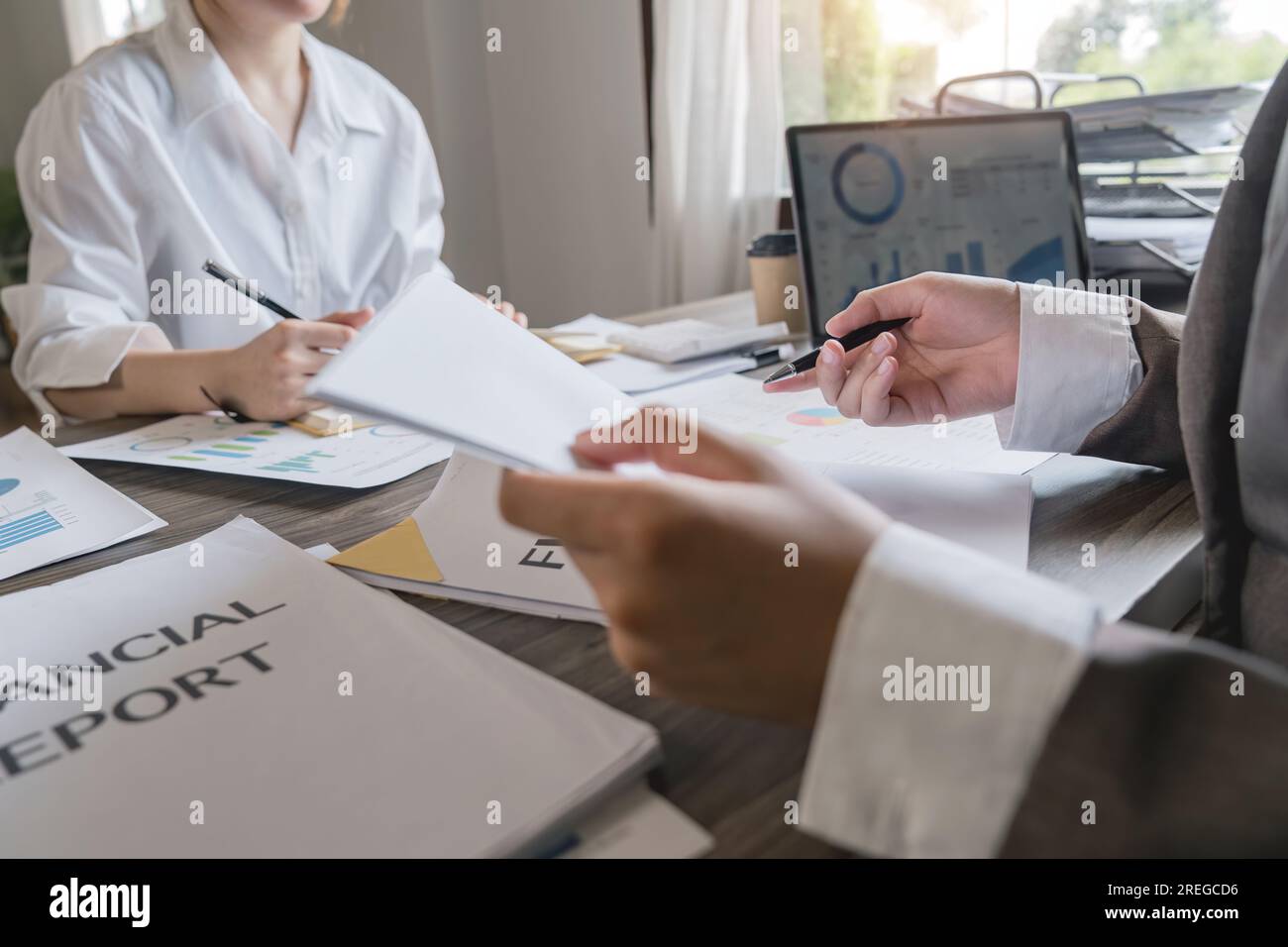 Two businessmen discussion analysis sharing calculations about the ...