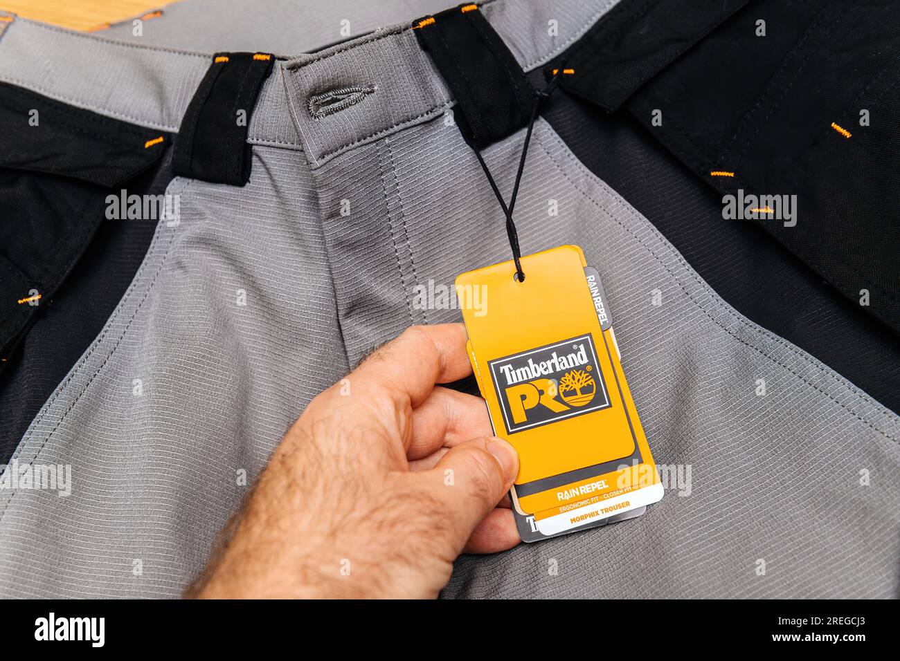 Hamburg, GErmany - Feb 16, 2022: Male hand looking at the Timberland ...