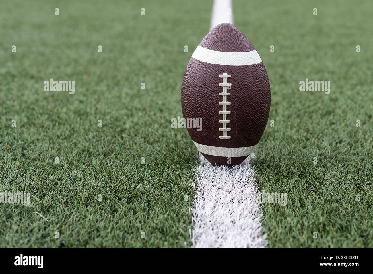 Football near the 50 yard line Stock Photo - Alamy