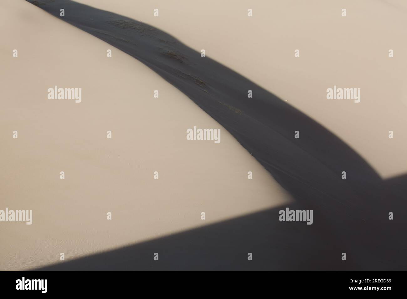 abstract of intersecting sand dunes and shadows Stock Photo - Alamy
