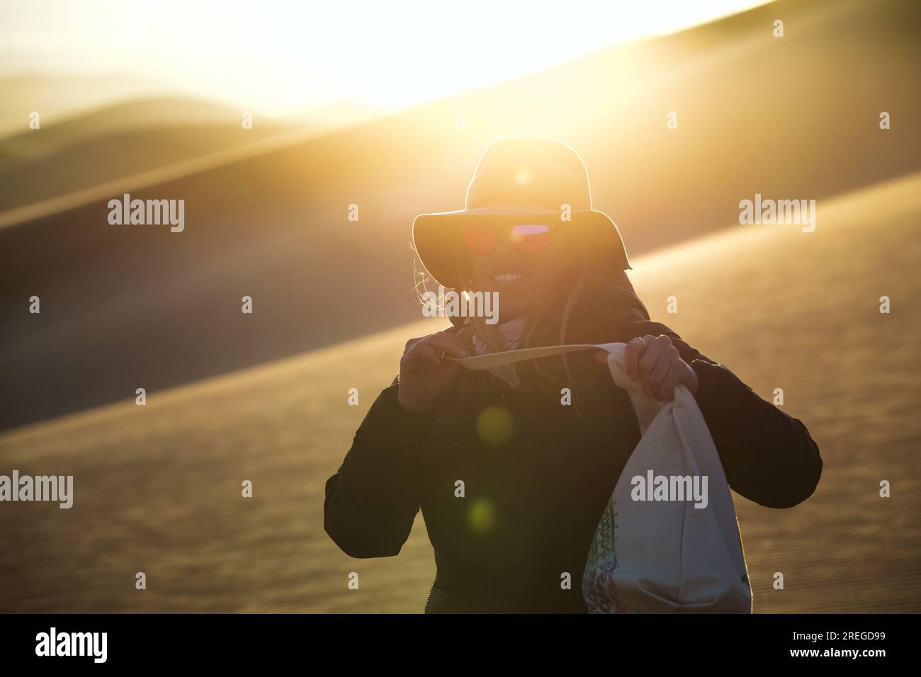 mid 30s female at golden hour in the sand dune desert of colorado Stock ...
