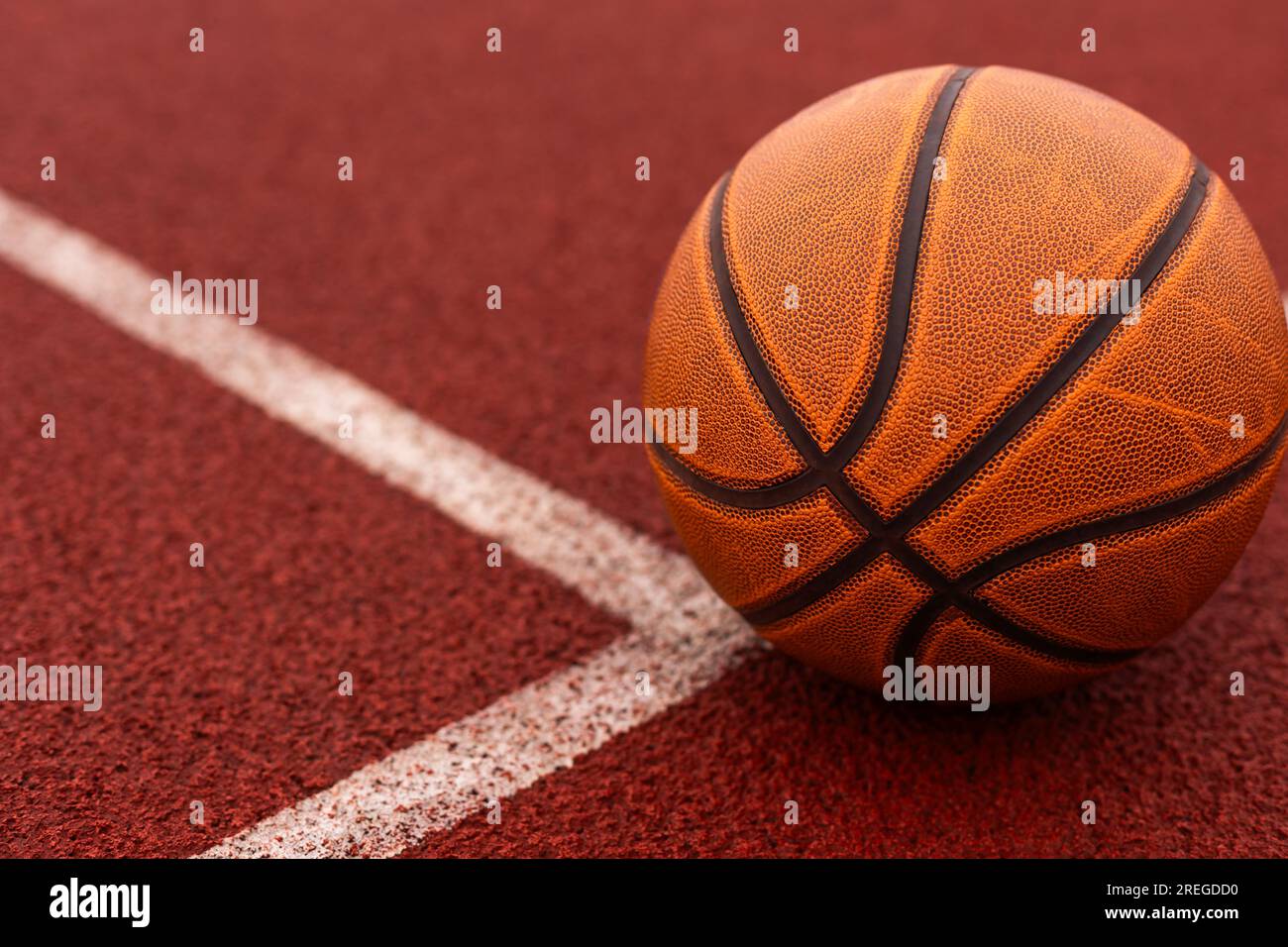 Orange basketball on brown court of gymnasium sport floor. Street ...