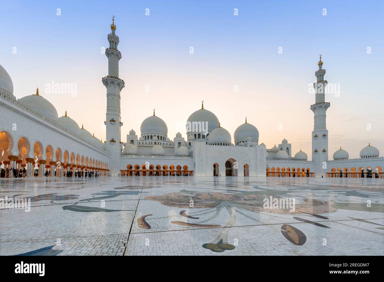 Wide view of Sheikh Zayed Mosque with lights and Sunset sky Stock Photo ...