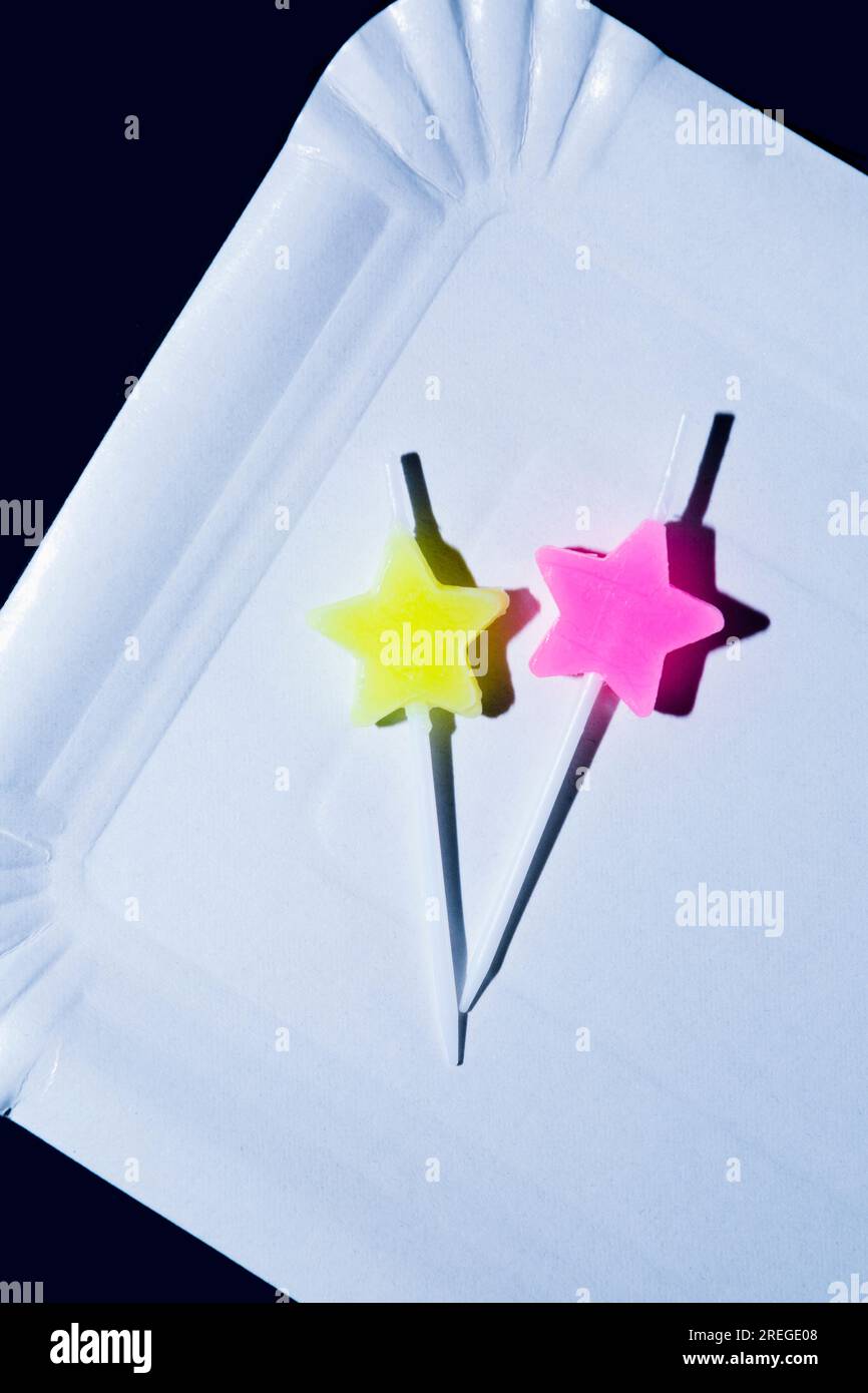 Top view on paper plate with two party candles Stock Photo - Alamy