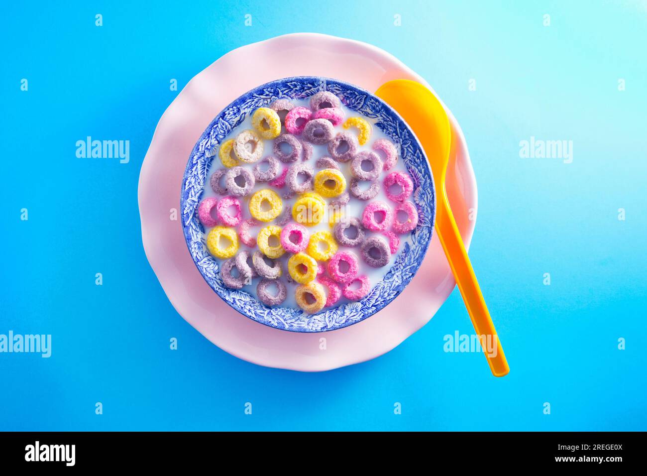 Top view on plate with cornflakes against blue Stock Photo - Alamy