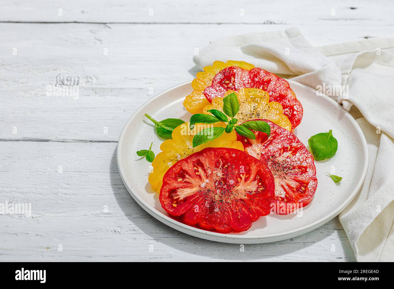Colorful Heirloom tomato harvest. Ripe ribbed vegetables with fresh ...
