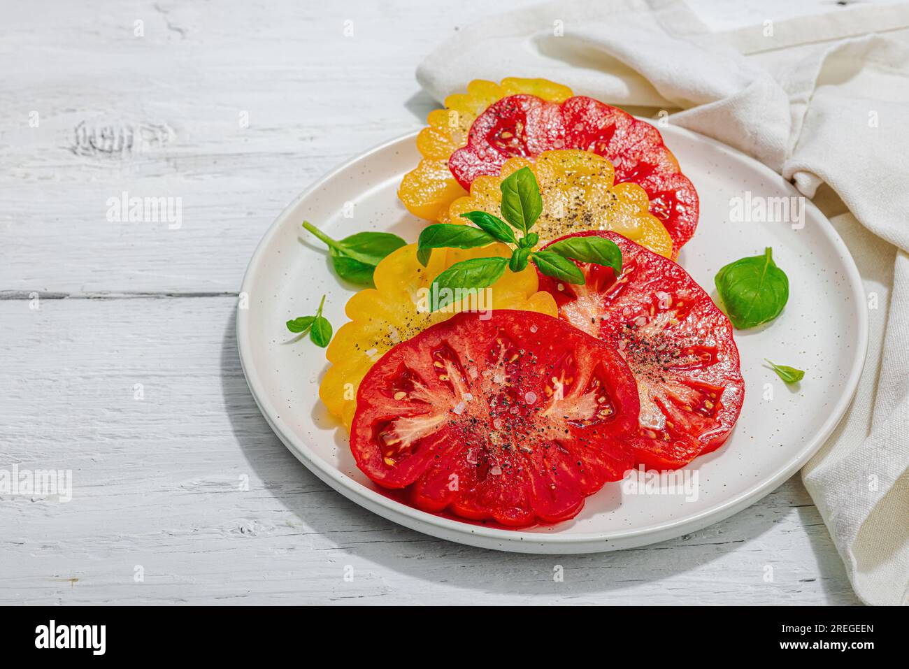Colorful Heirloom tomato harvest. Ripe ribbed vegetables with fresh ...