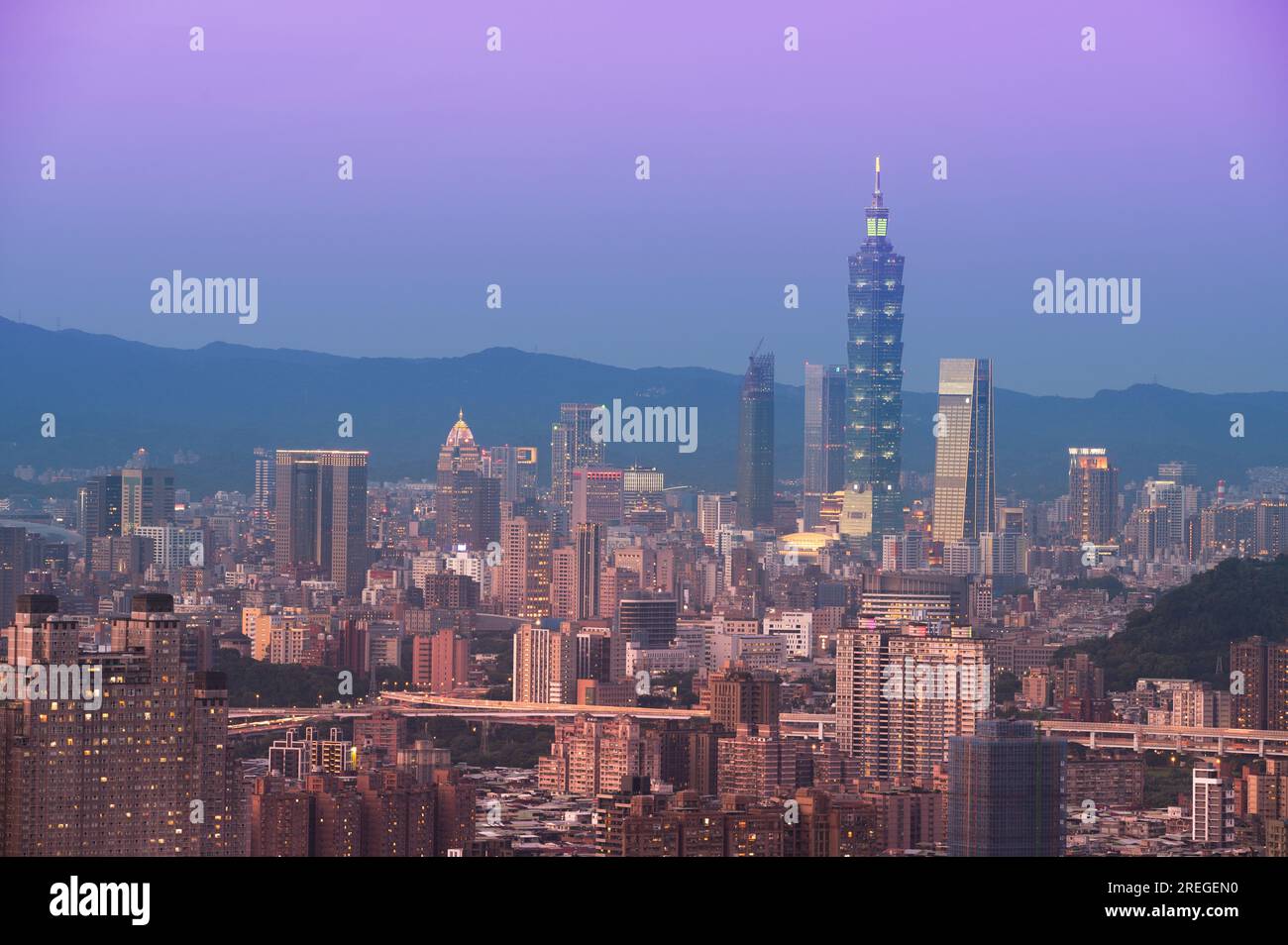Dusk turns into a brightly lit bustling city. Dynamic clouds. Zhonghe ...