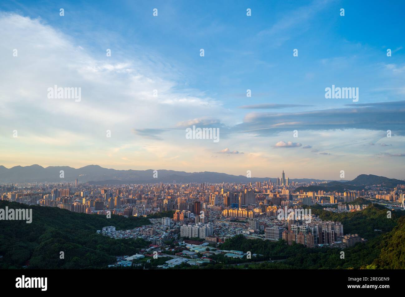 At dusk with blue sky and white clouds, clean and beautiful cityscape ...