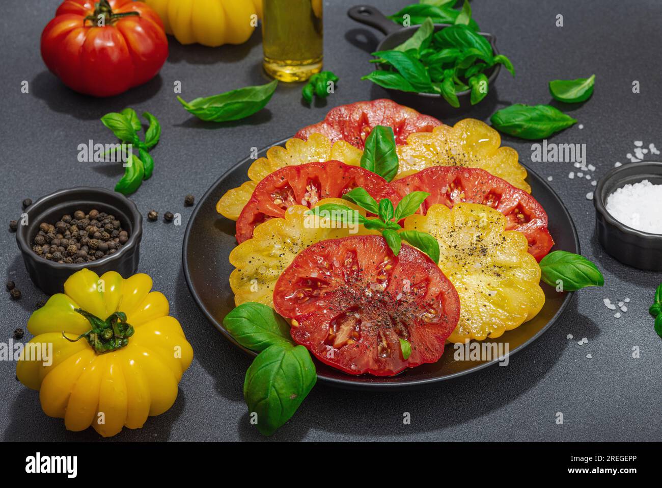 Colorful Heirloom tomato harvest. Ripe ribbed vegetables with fresh ...