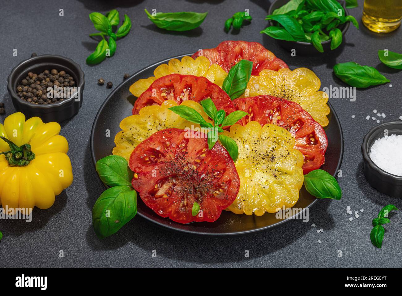 Colorful Heirloom tomato harvest. Ripe ribbed vegetables with fresh ...
