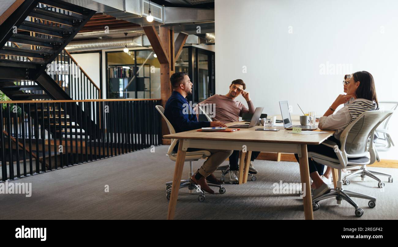 business people having a meeting in an advertising agency. Group of ...