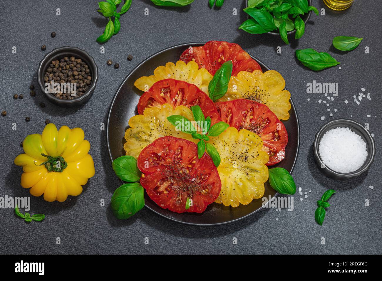 Colorful Heirloom tomato harvest. Ripe ribbed vegetables with fresh ...