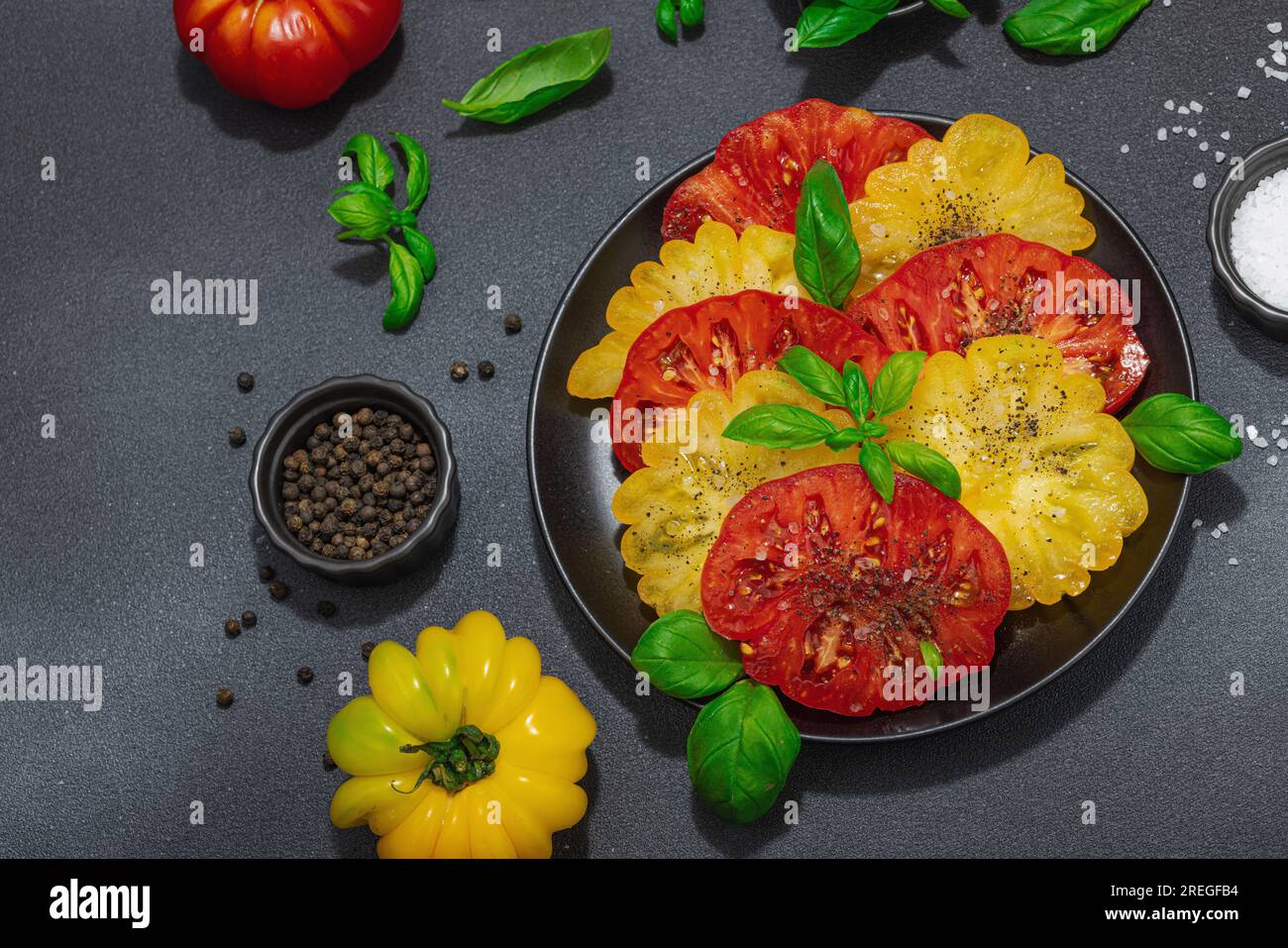Colorful Heirloom tomato harvest. Ripe ribbed vegetables with fresh ...