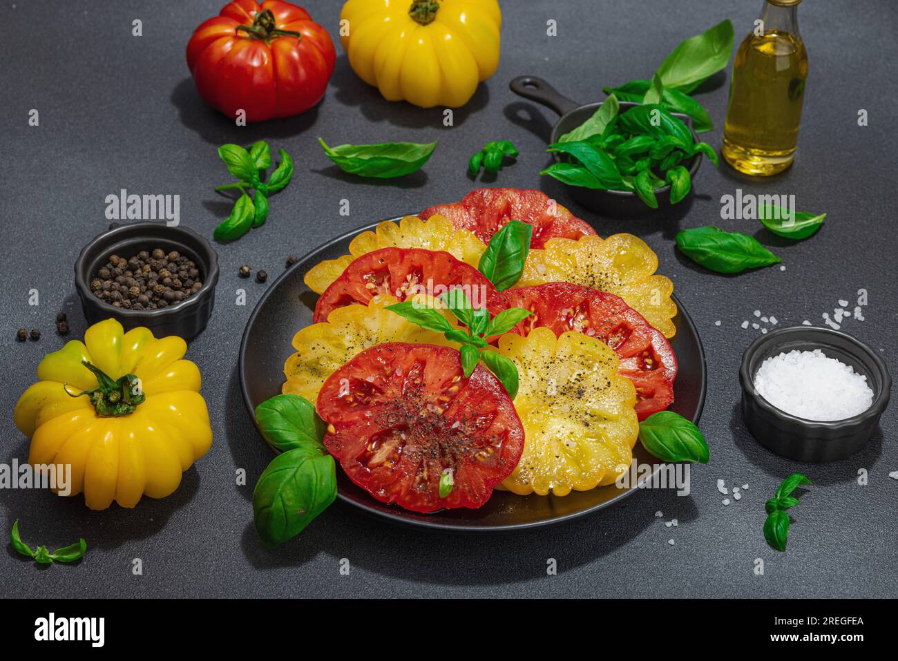 Colorful Heirloom tomato harvest. Ripe ribbed vegetables with fresh ...