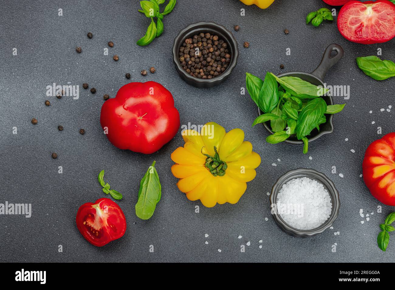 Colorful Heirloom tomato harvest. Ripe ribbed vegetables with fresh ...