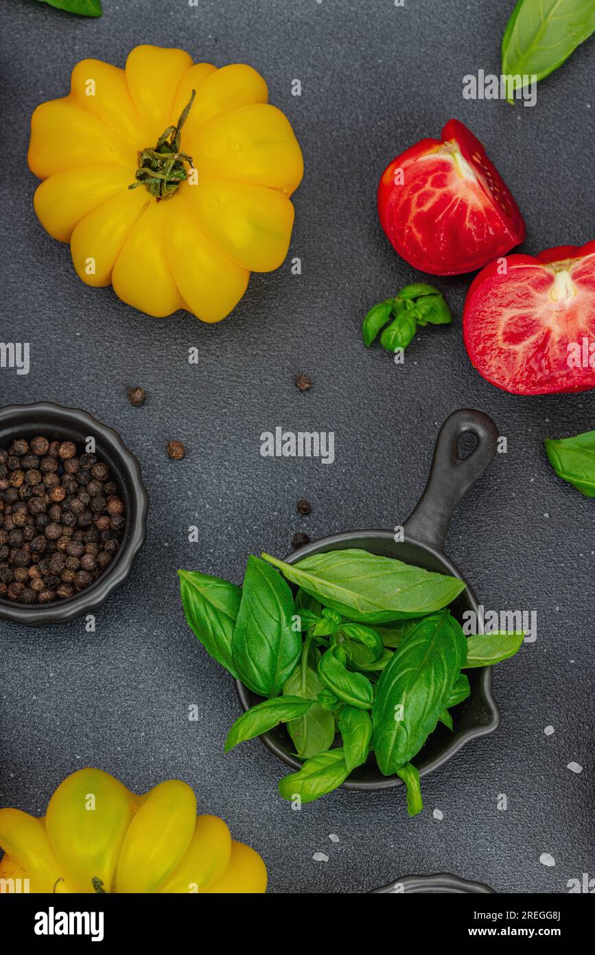 Colorful Heirloom tomato harvest. Ripe ribbed vegetables with fresh ...