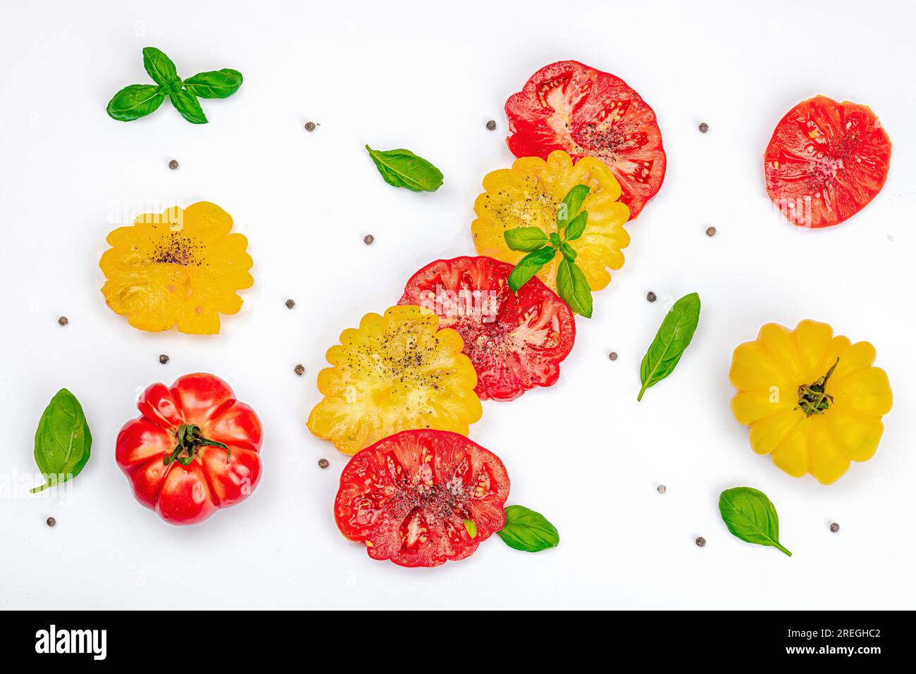 Colorful Heirloom tomato harvest isolated on white background. Ripe ...