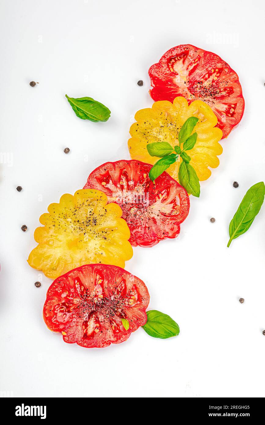 Colorful Heirloom tomato harvest isolated on white background. Ripe ...