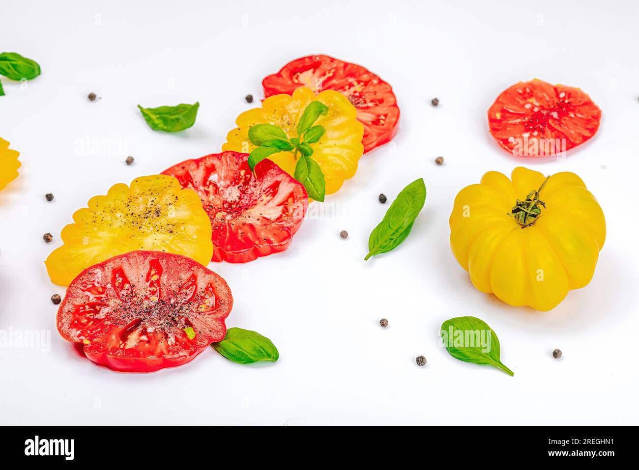 Colorful Heirloom tomato harvest isolated on white background. Ripe ...