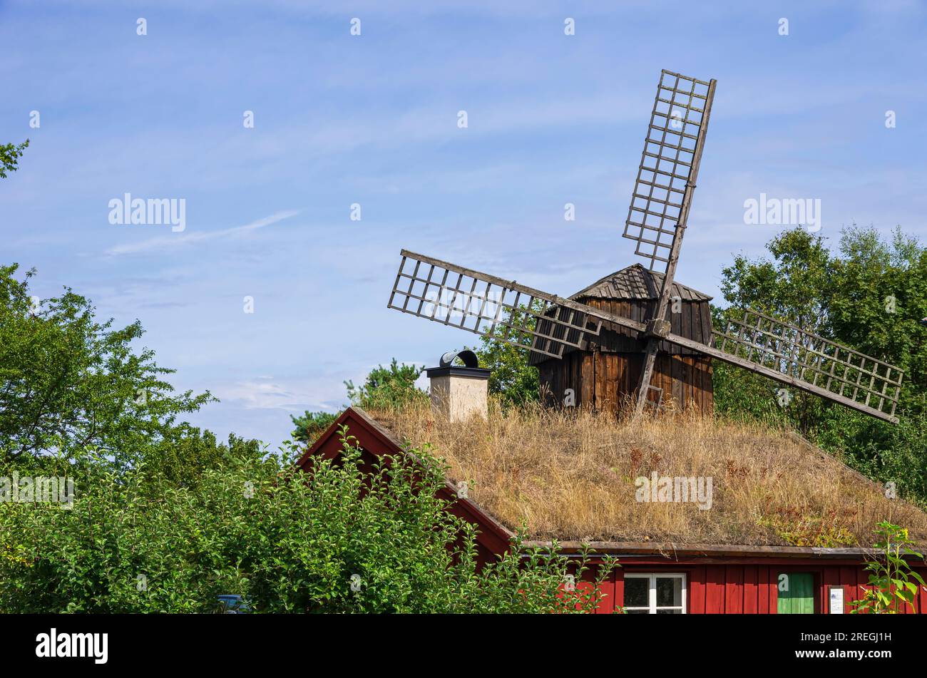 Historic wooden hut and windmill, buildings of the town museum ...
