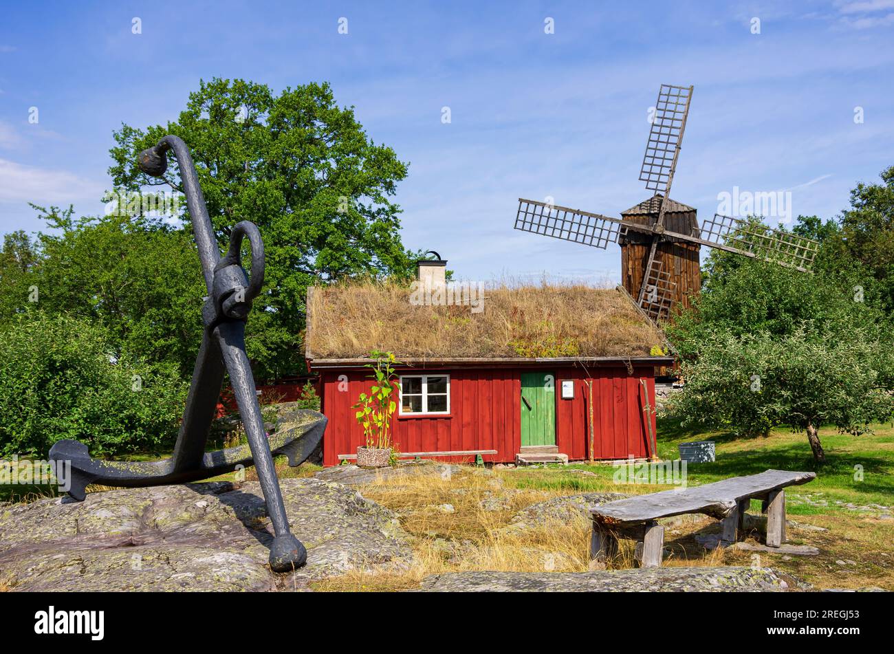 Historic wooden hut and windmill, buildings of the town museum ...