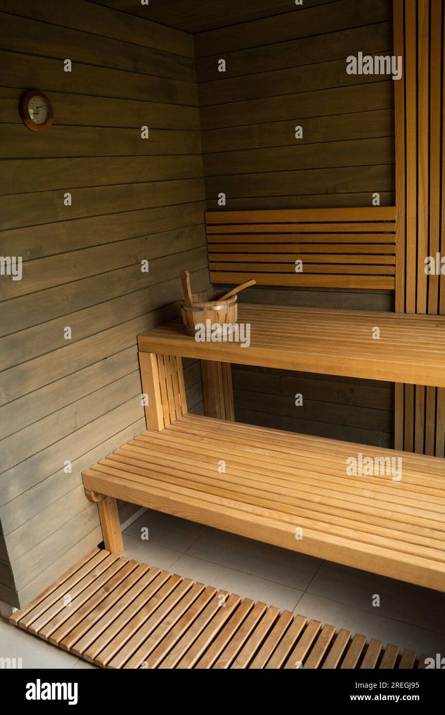 Modern wooden Finnish sauna interior with wooden benches. Wooden ...