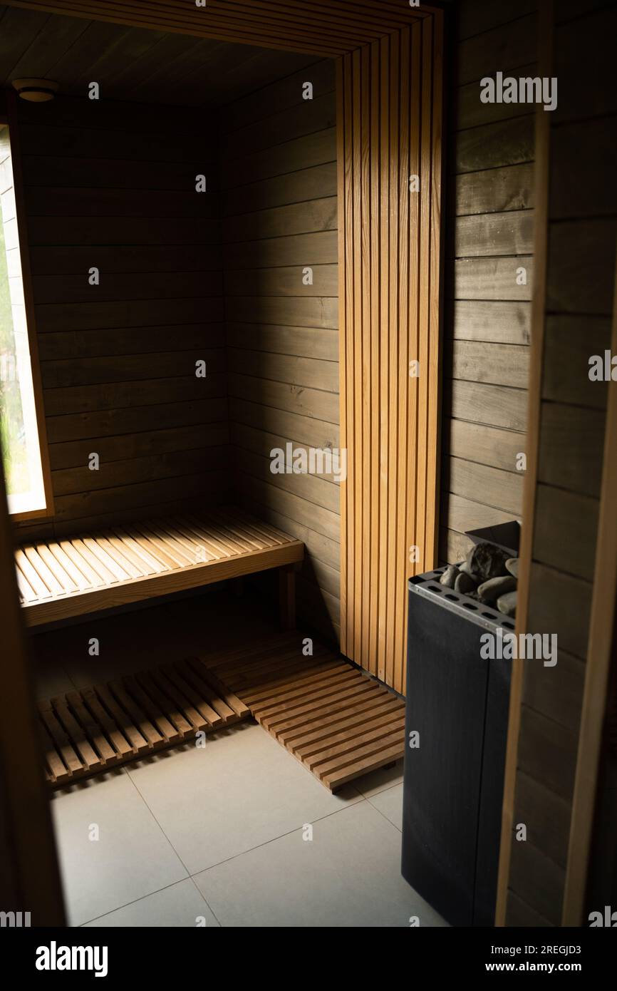 Interior of empty traditional finnish sauna room with wooden wall and ...