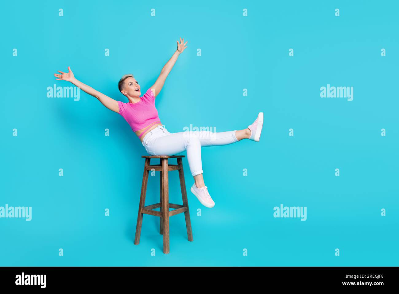 Full size photo of funky girl dressed white trousers look empty space ...