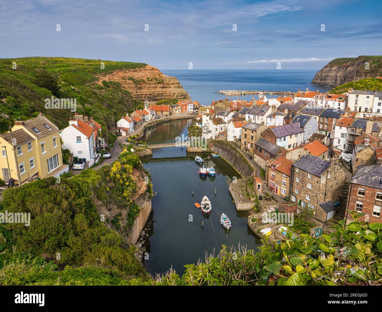 The iconic view of Staithes, looking over Staithes Beck and the ...