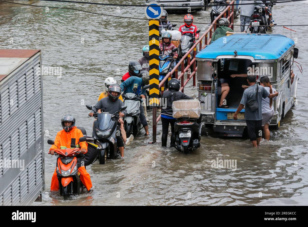 Valenzuela City, Philippines. 28th July, 2023. People ride on a ...