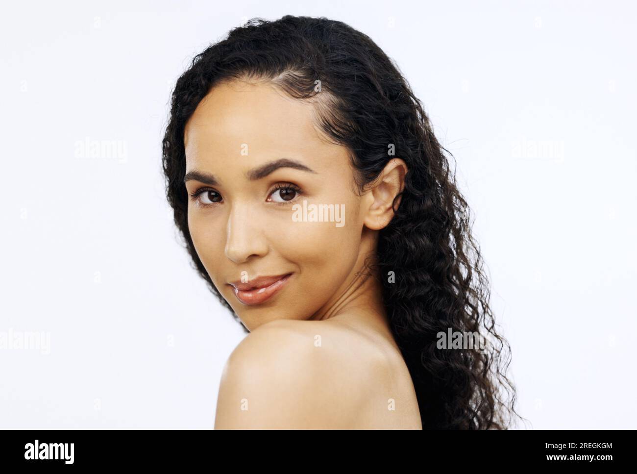 Black woman, over shoulder face and beauty with smirk and flirt ...