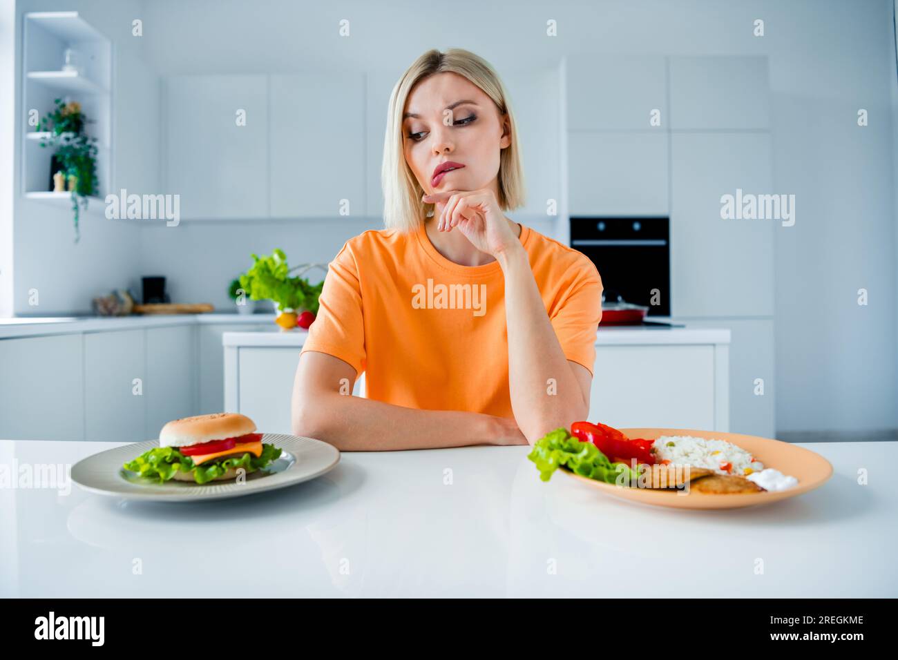 Photo of minded pensive person biting lips dilemma pick rice meat ...