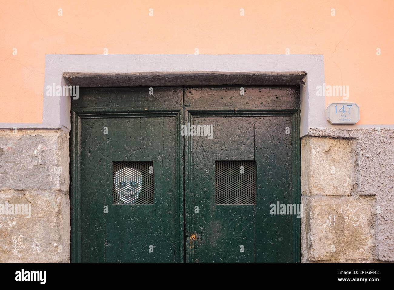 Cinque Terre, Italy - creepy skeleton head looks out through a square ...