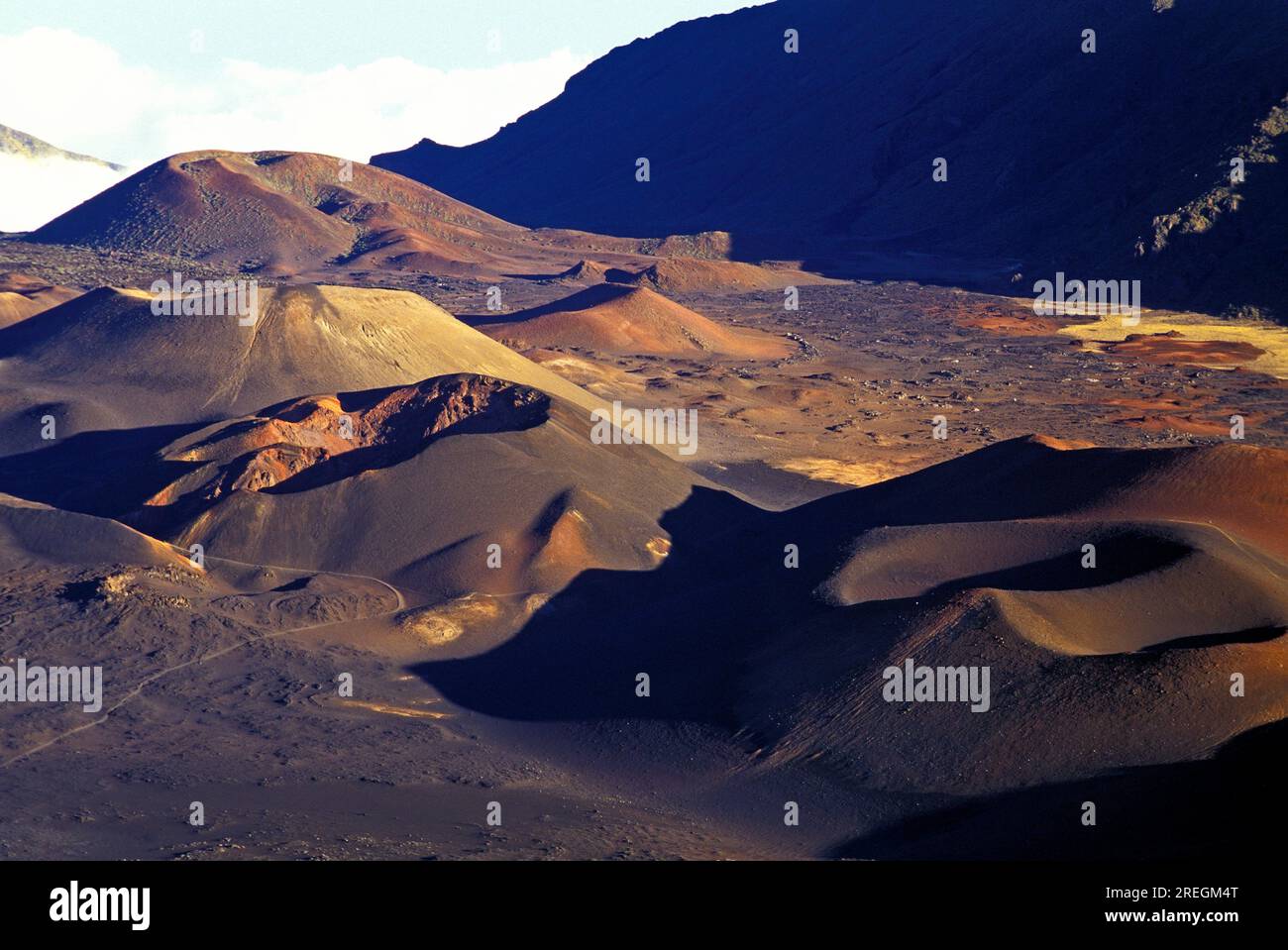 Moon-like cinder cones composed of red sand inside the crater at ...