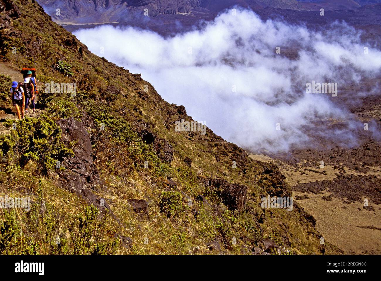 Hikers enjoy the spectacular scenery inside the crater at Haleakala ...