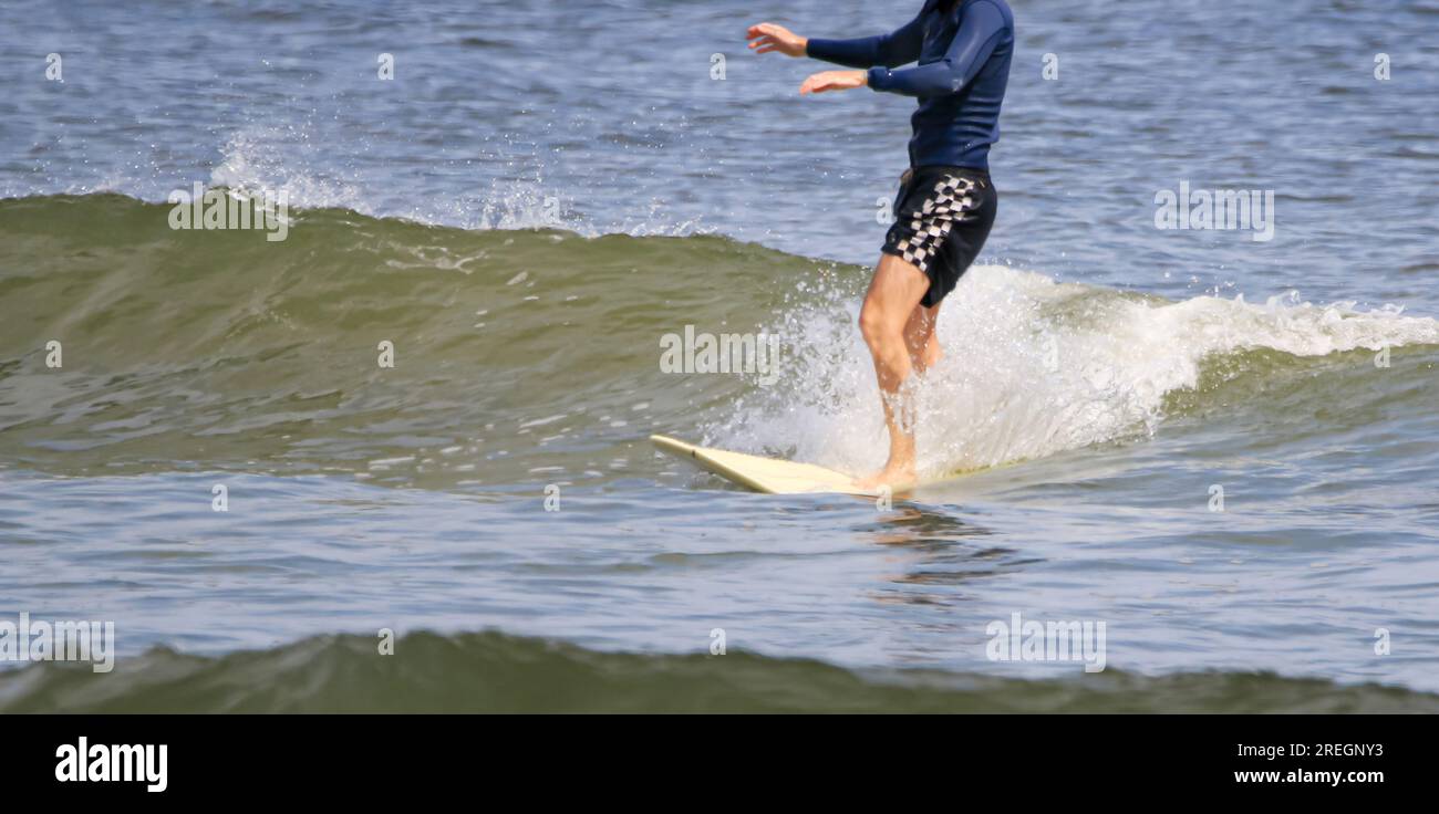Male surfer riding wave hi-res stock photography and images - Alamy