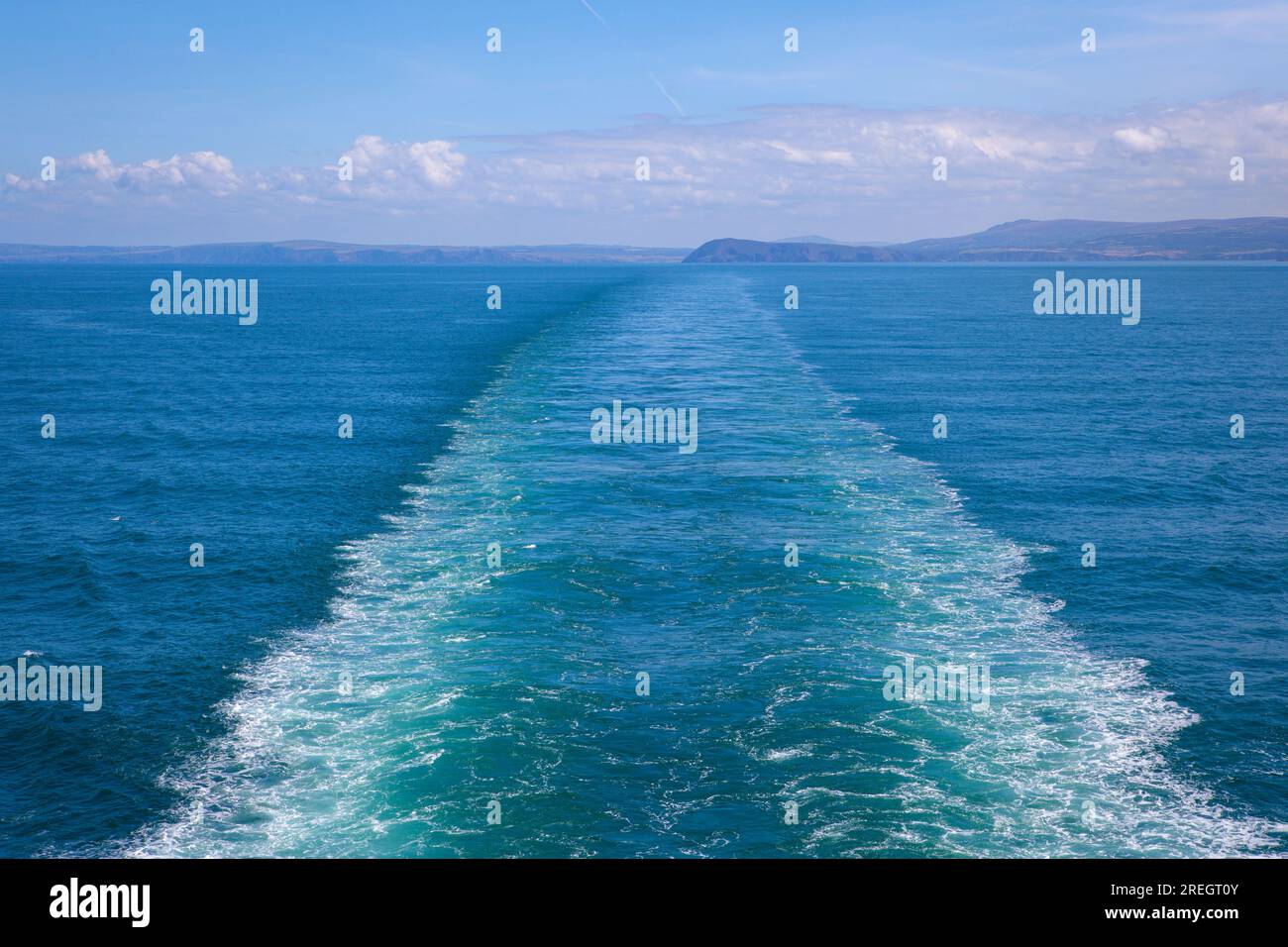 The wake from a ferry crossing the Irish sea on a clear, clam day Stock ...