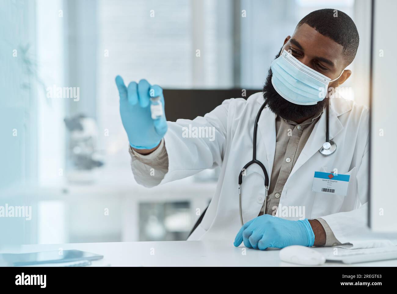 Medicine, vaccine and a doctor man with a mask for virus protection ...
