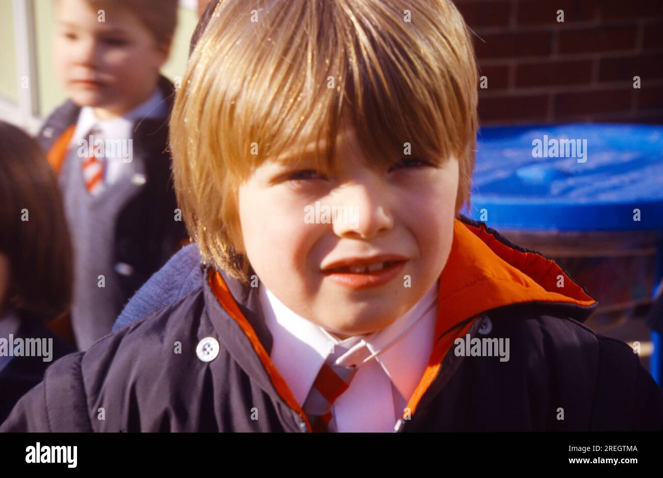Portrait of a Boy Aged 6 Squinting with the sun in his eyes England ...