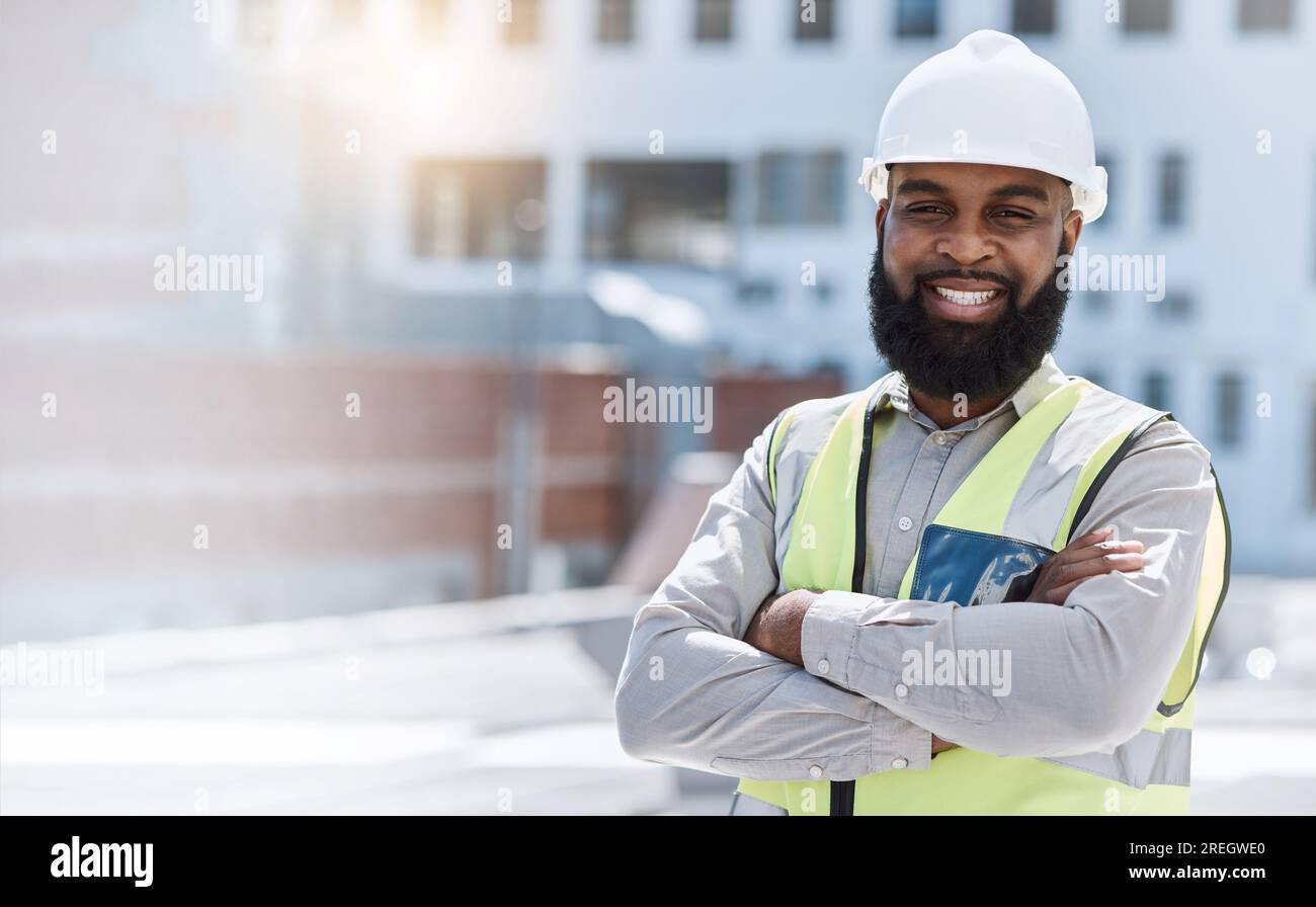 Man, engineering portrait and arms crossed at city construction site ...