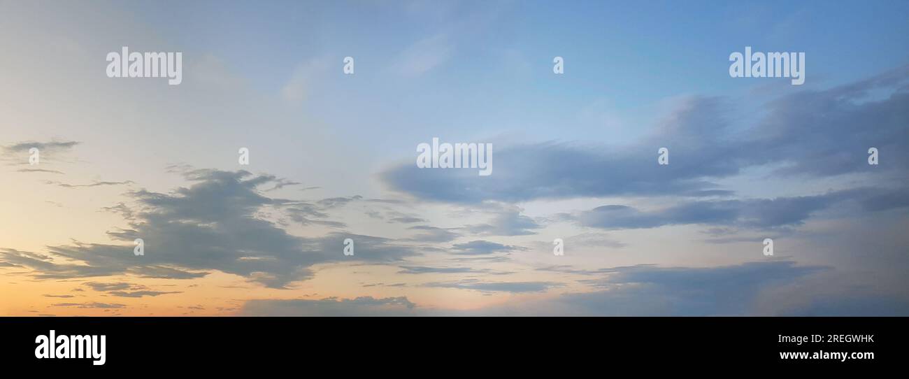Blue sky with clouds and yellow twilight, nature background Stock Photo ...