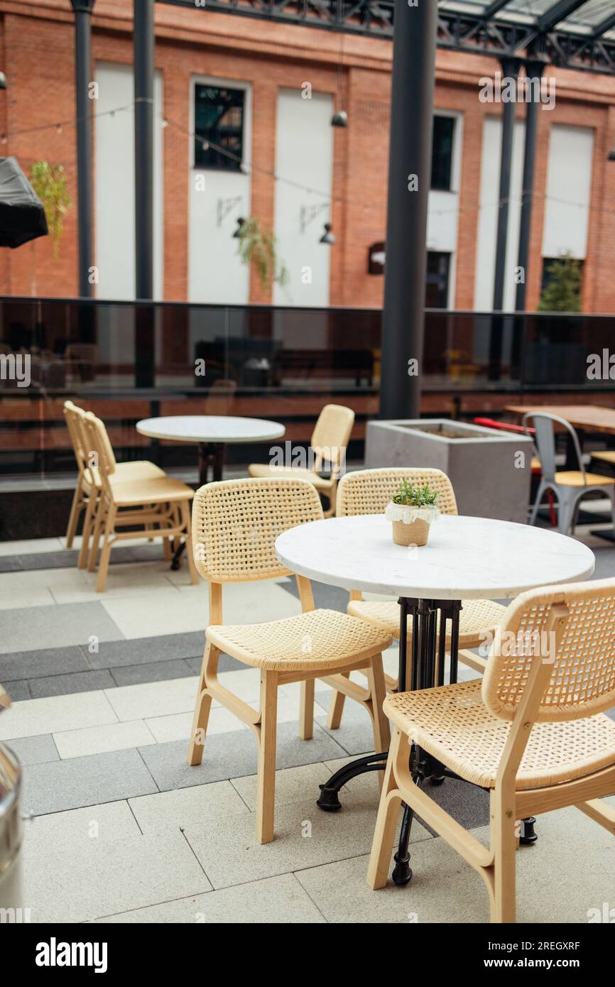 Cafe interior design. Interior design style, wooden tables and chairs ...