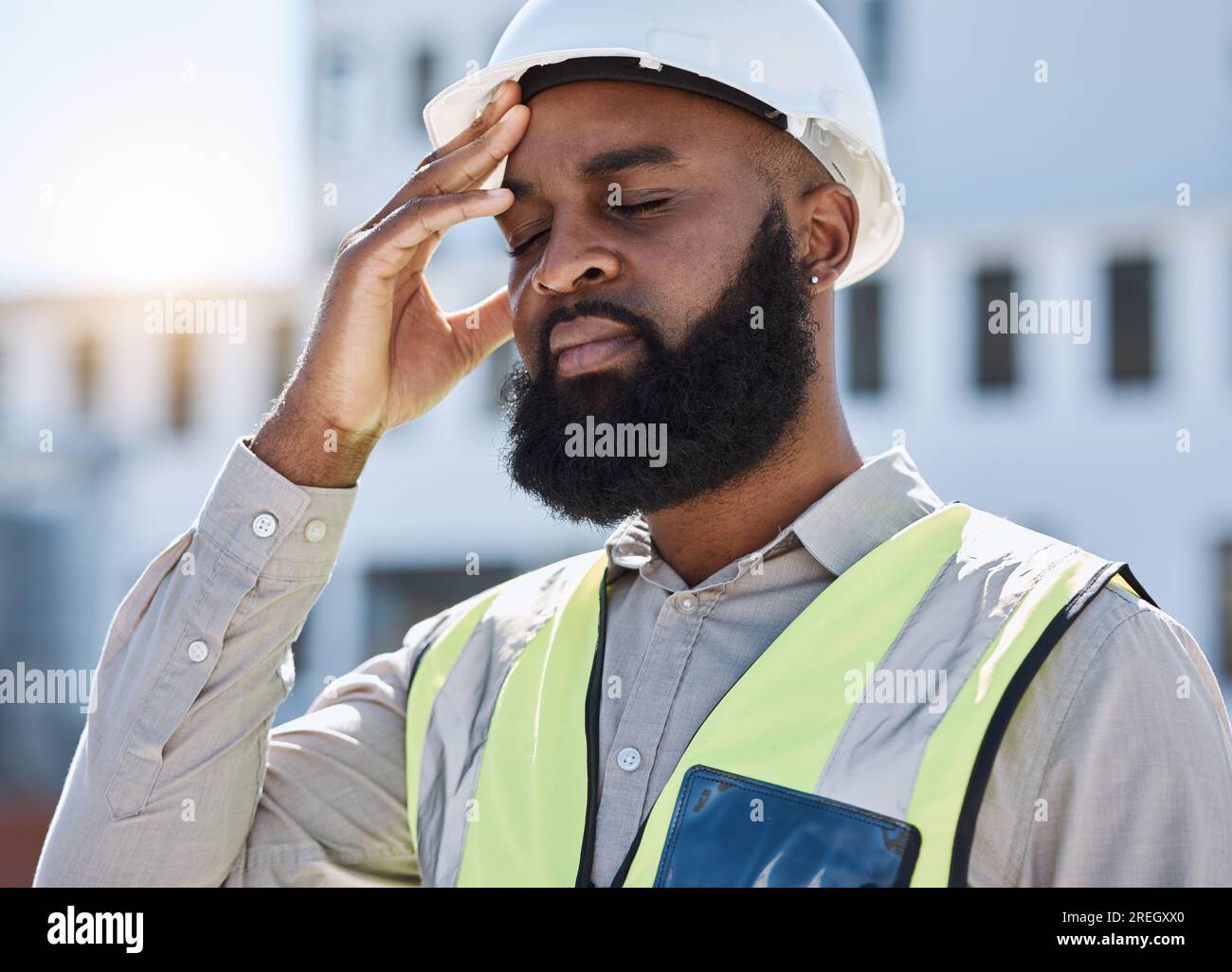 Construction, man and worker with headache, stress of building ...