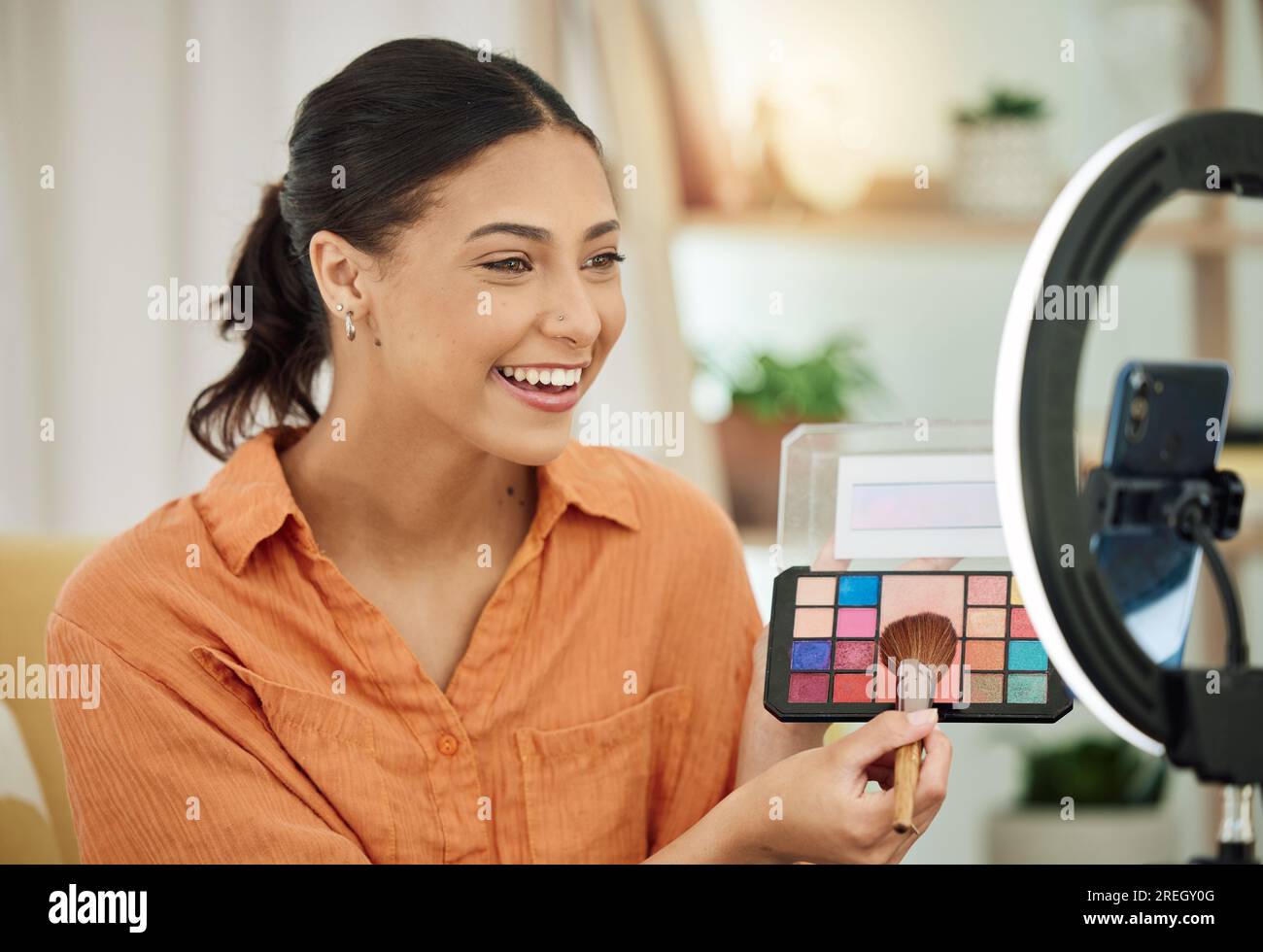 Happy woman, makeup influencer and live streaming with phone, social ...