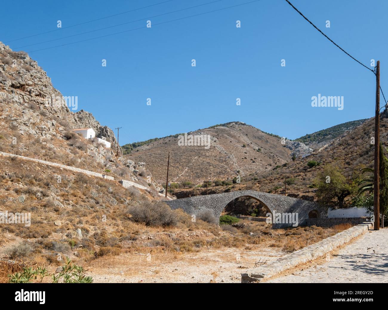 Kamaroti ancient stone bridge, Vlychos, Hydra, Greece, with hills ...