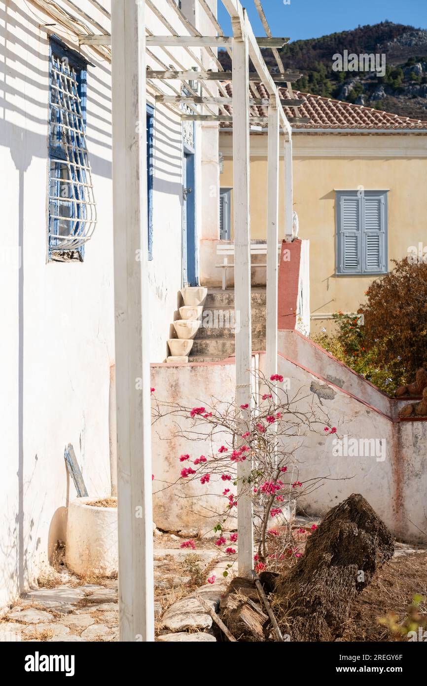 An empty building in Hydra, Greece, with a staircase to the rear and a ...