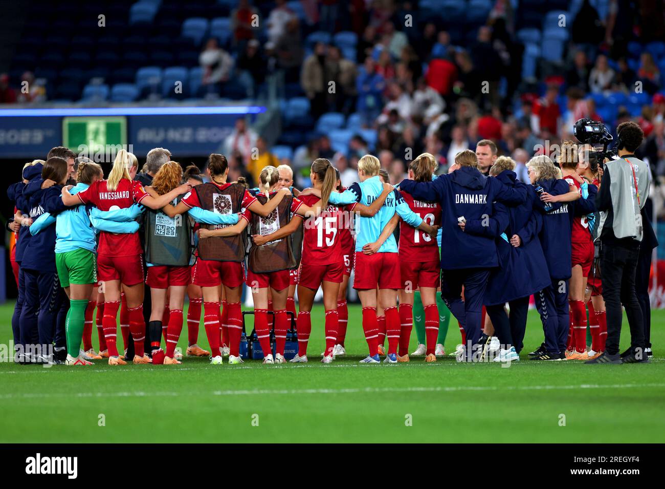 Denmark players and staff members huddle together on the pitch at the ...